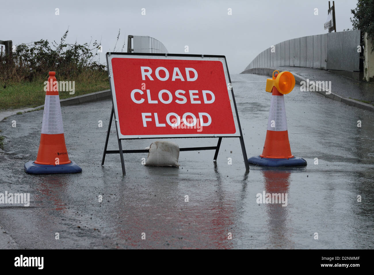 road closed flood warning sign with cones Stock Photo - Alamy