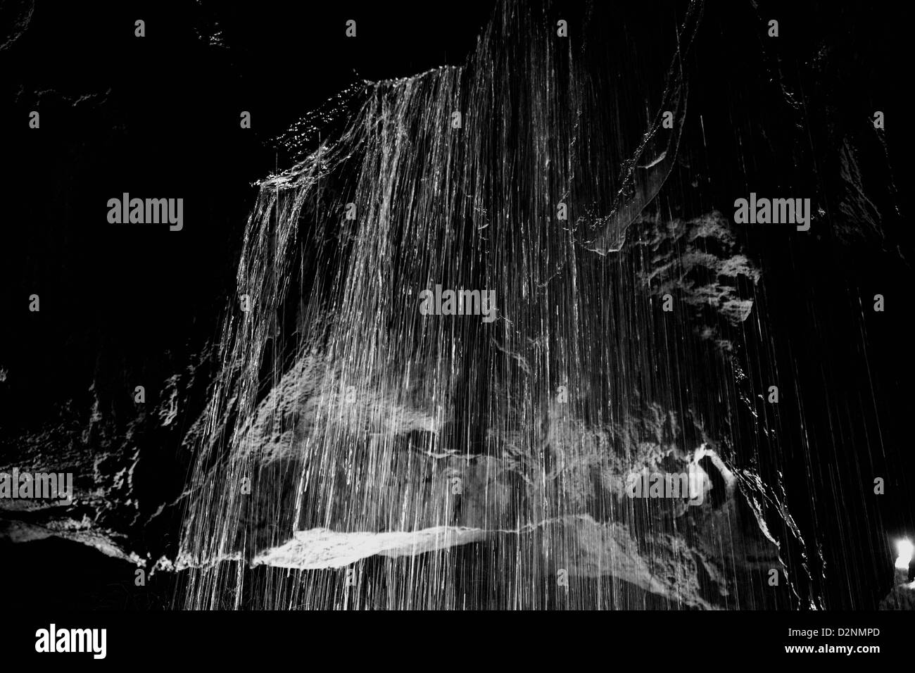 Underground waterfall, in a cave, giving abstract image of the stream ...