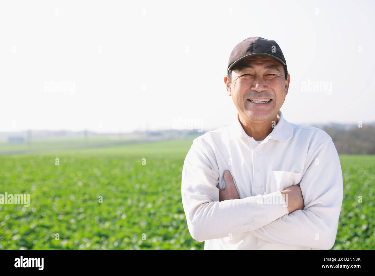 Farmer smiling at camera Stock Photo - Alamy