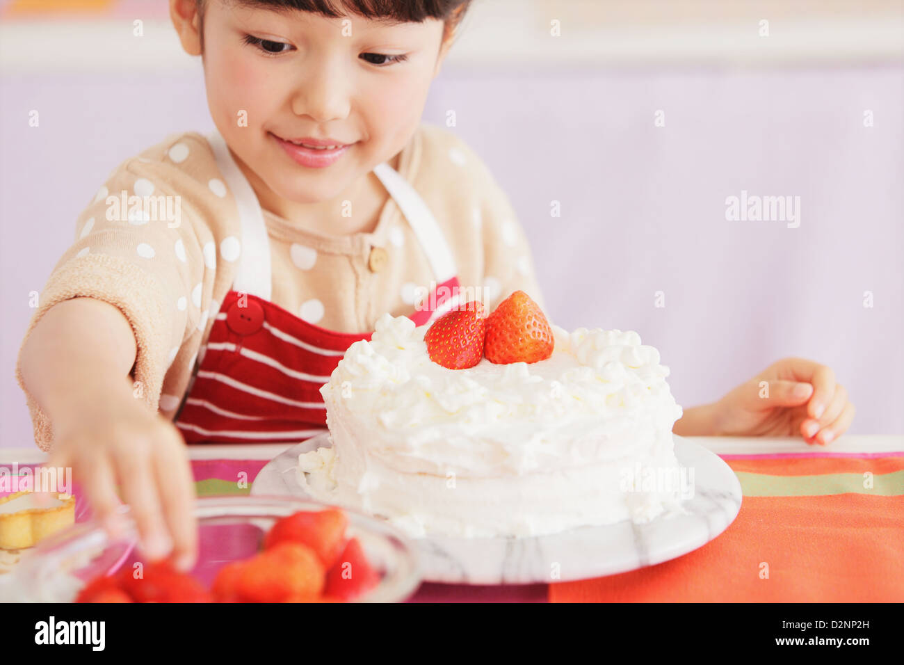 Young girl making a cake Stock Photo - Alamy