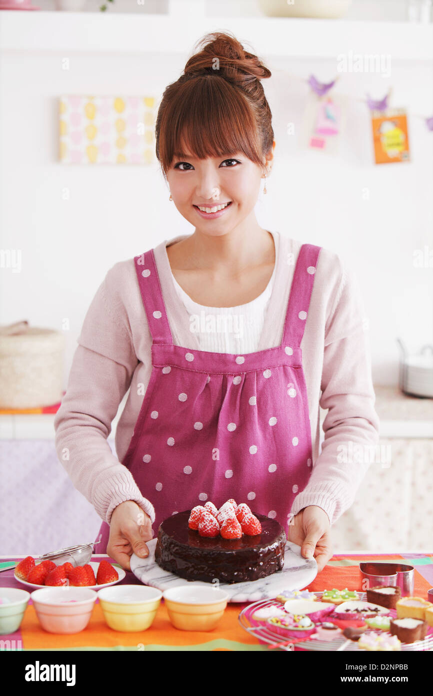 Pretty woman making cake in hi-res stock photography and images - Alamy