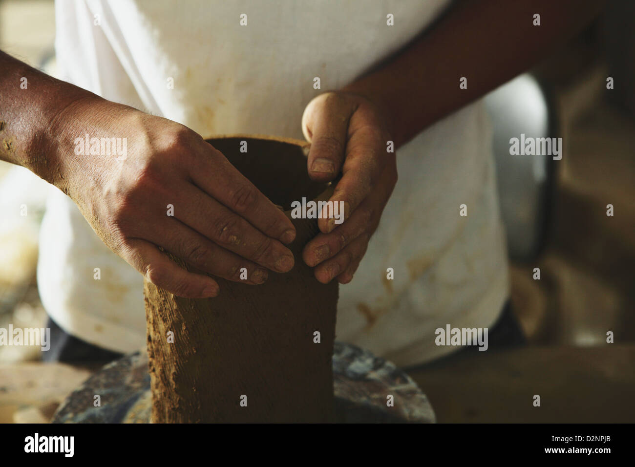 Craftsman working clay Stock Photo - Alamy