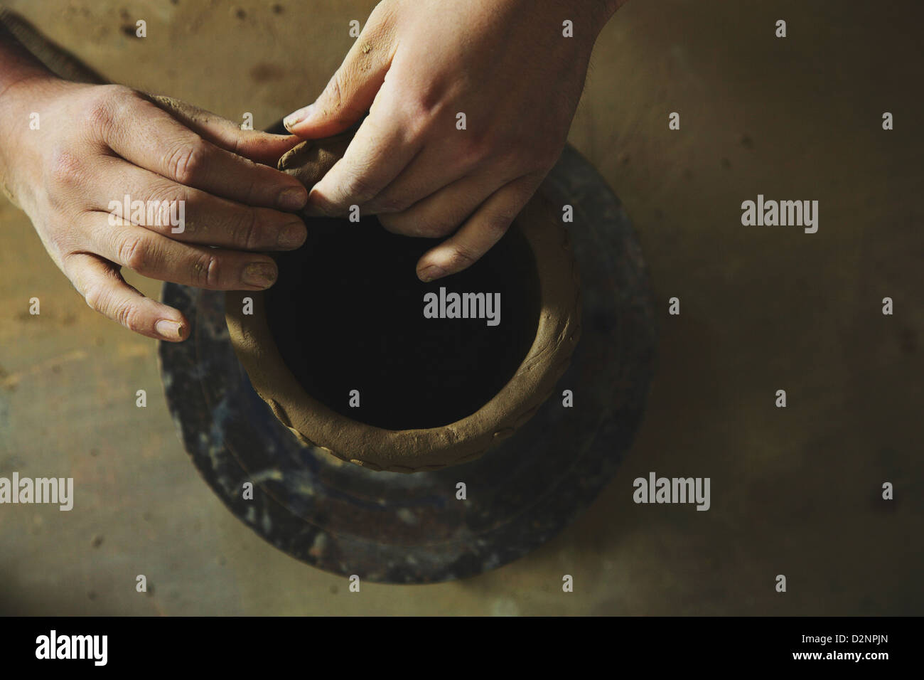 Craftsman working clay Stock Photo - Alamy