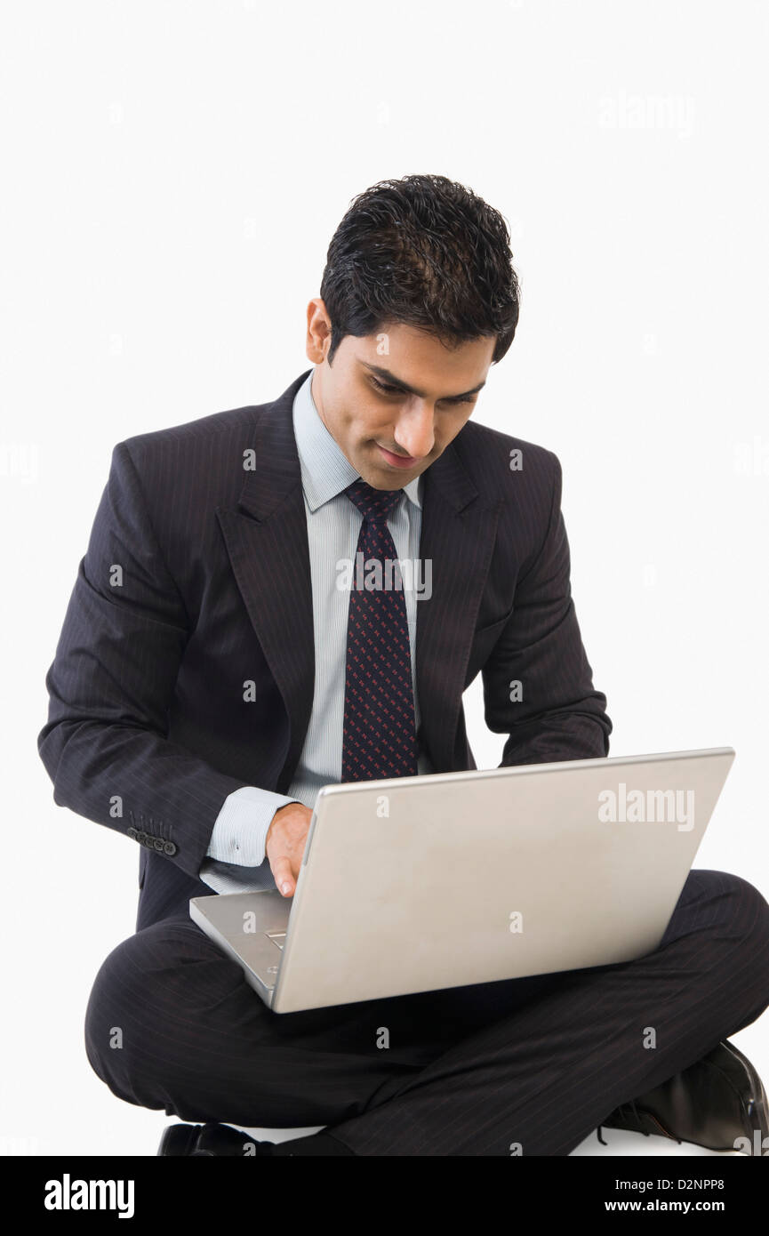 Businessman using a laptop Stock Photo - Alamy