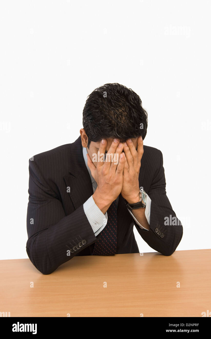 Executive sitting with elbows on desk hi-res stock photography and ...