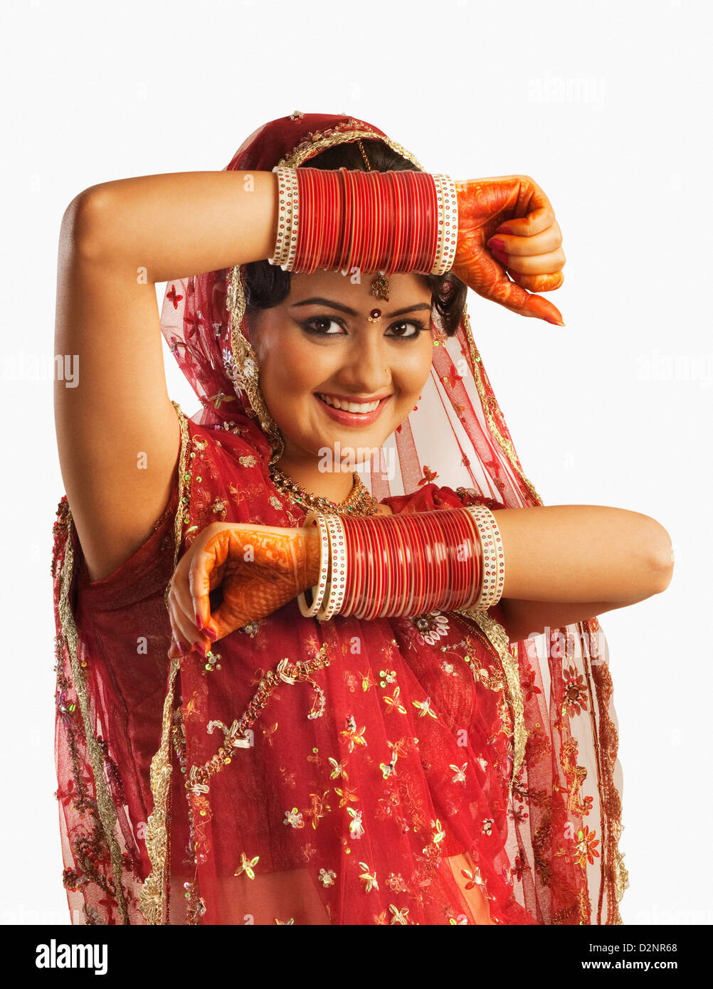 Portrait of a bride smiling in traditional wedding dress Stock Photo ...