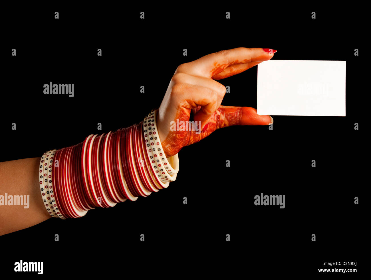 Bride's hand showing a visiting card Stock Photo - Alamy