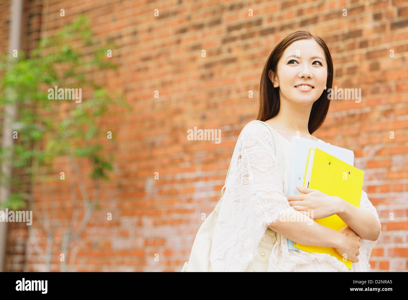 Young woman with a binder Stock Photo - Alamy