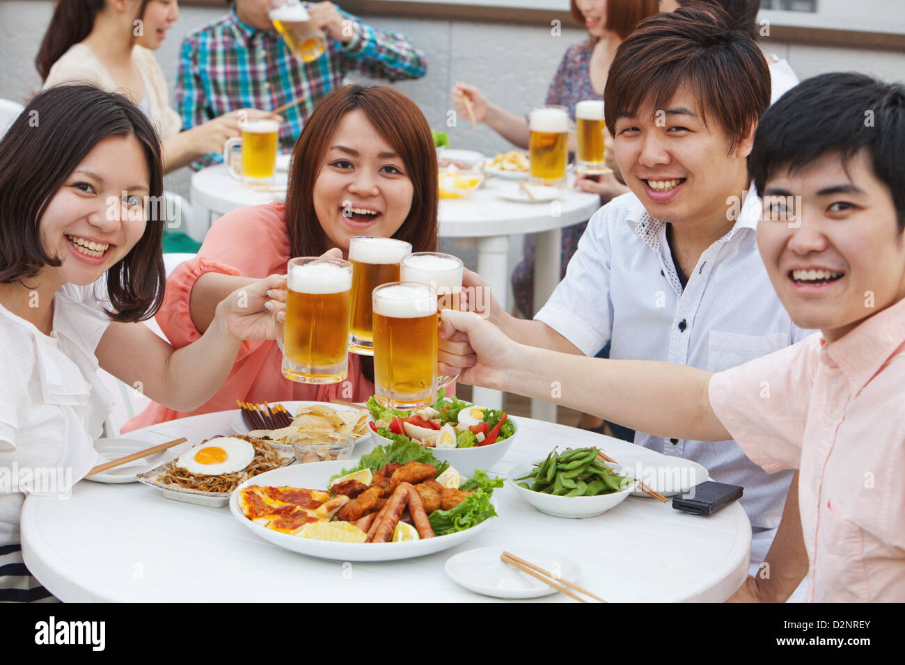 Friends drinking together Stock Photo - Alamy
