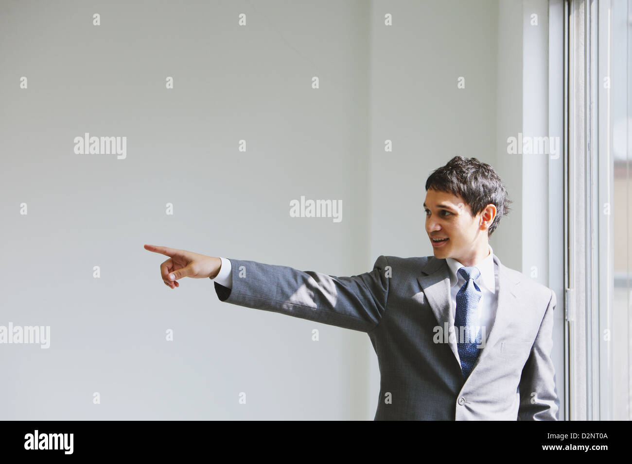 Businessman pointing a finger Stock Photo - Alamy