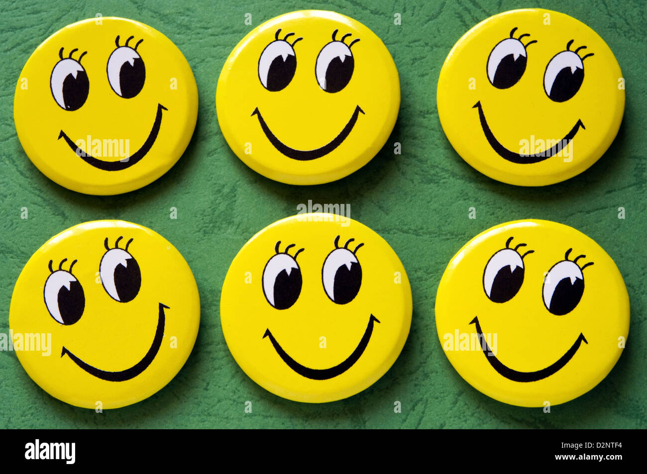 smile badges in studio setting Stock Photo - Alamy