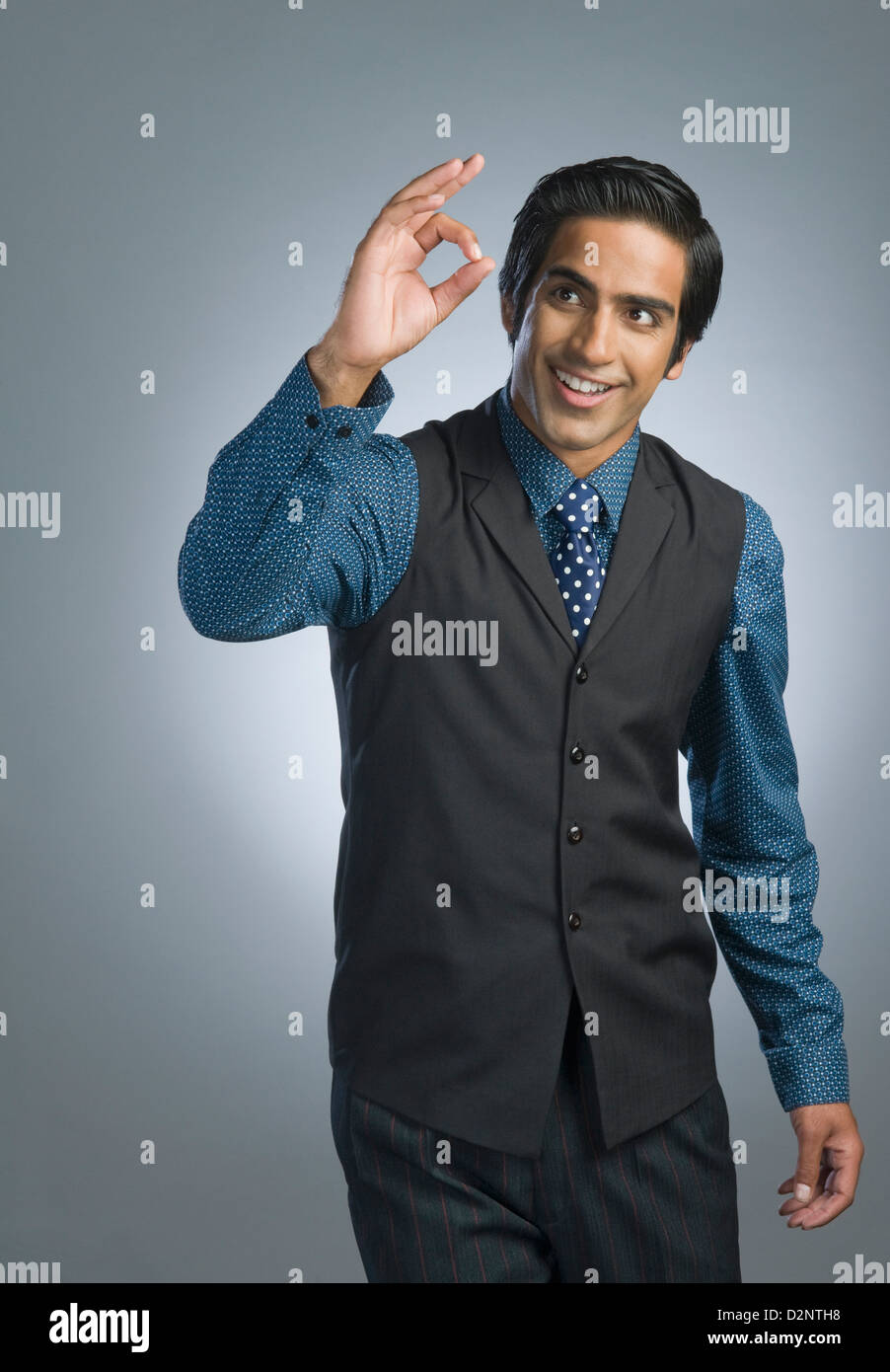 Businessman showing OK sign and smiling Stock Photo - Alamy