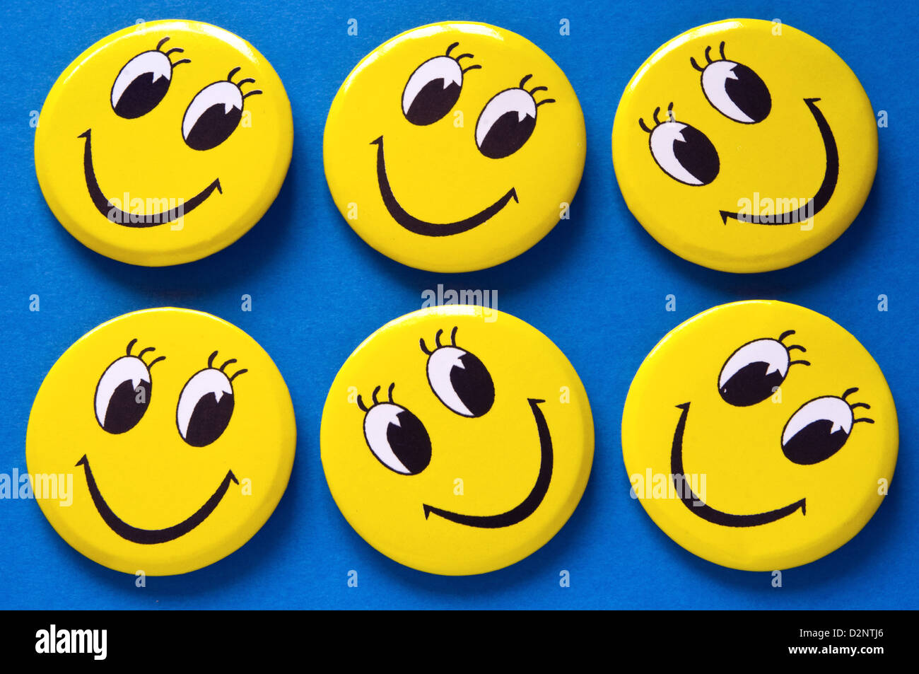 smile badges in studio setting Stock Photo - Alamy