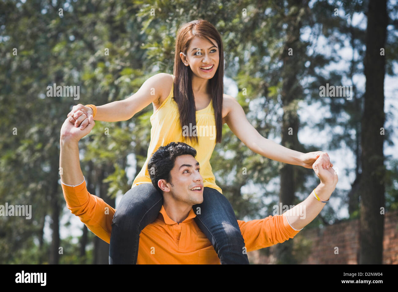 Man carrying a woman on his shoulders Stock Photo - Alamy