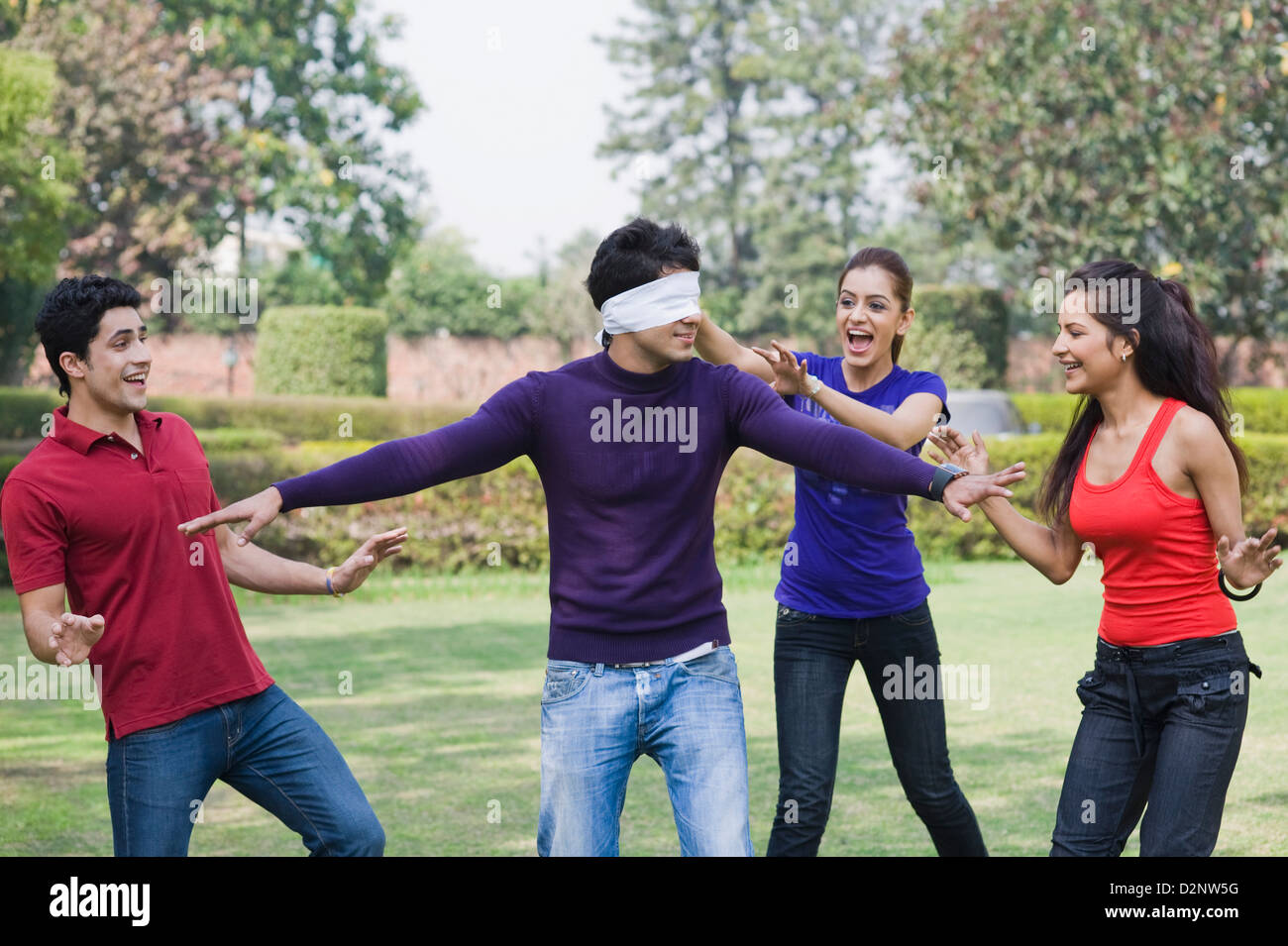 Friends playing blind man's bluff Stock Photo - Alamy