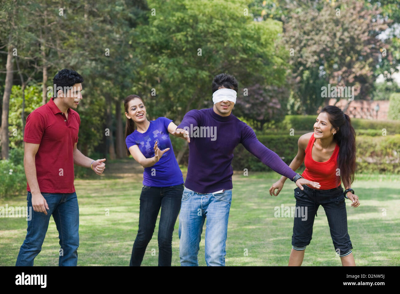 Friends playing blind man's bluff Stock Photo - Alamy