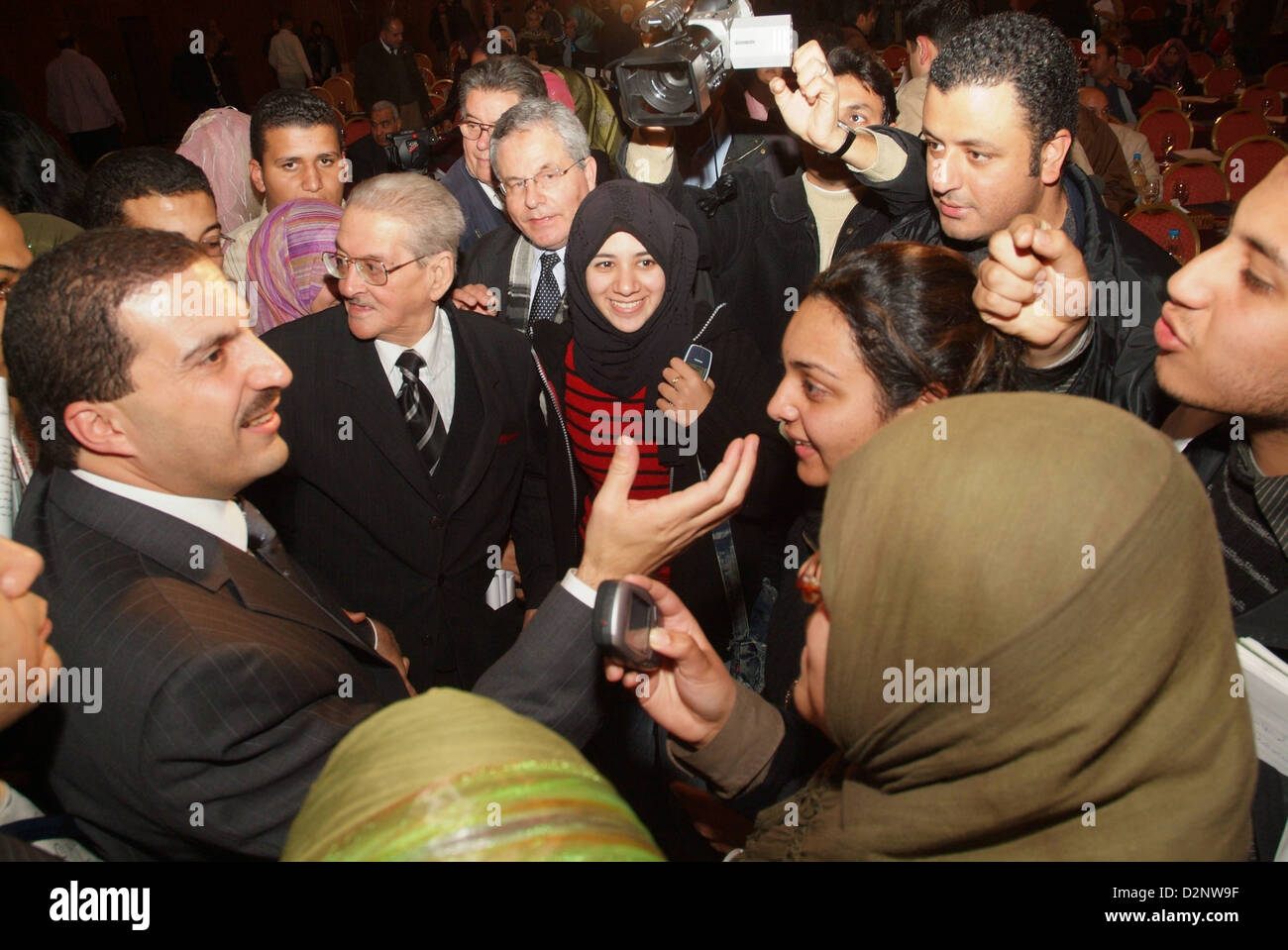Amr Khaled greeted by his supporters at a press conference in Cairo ...