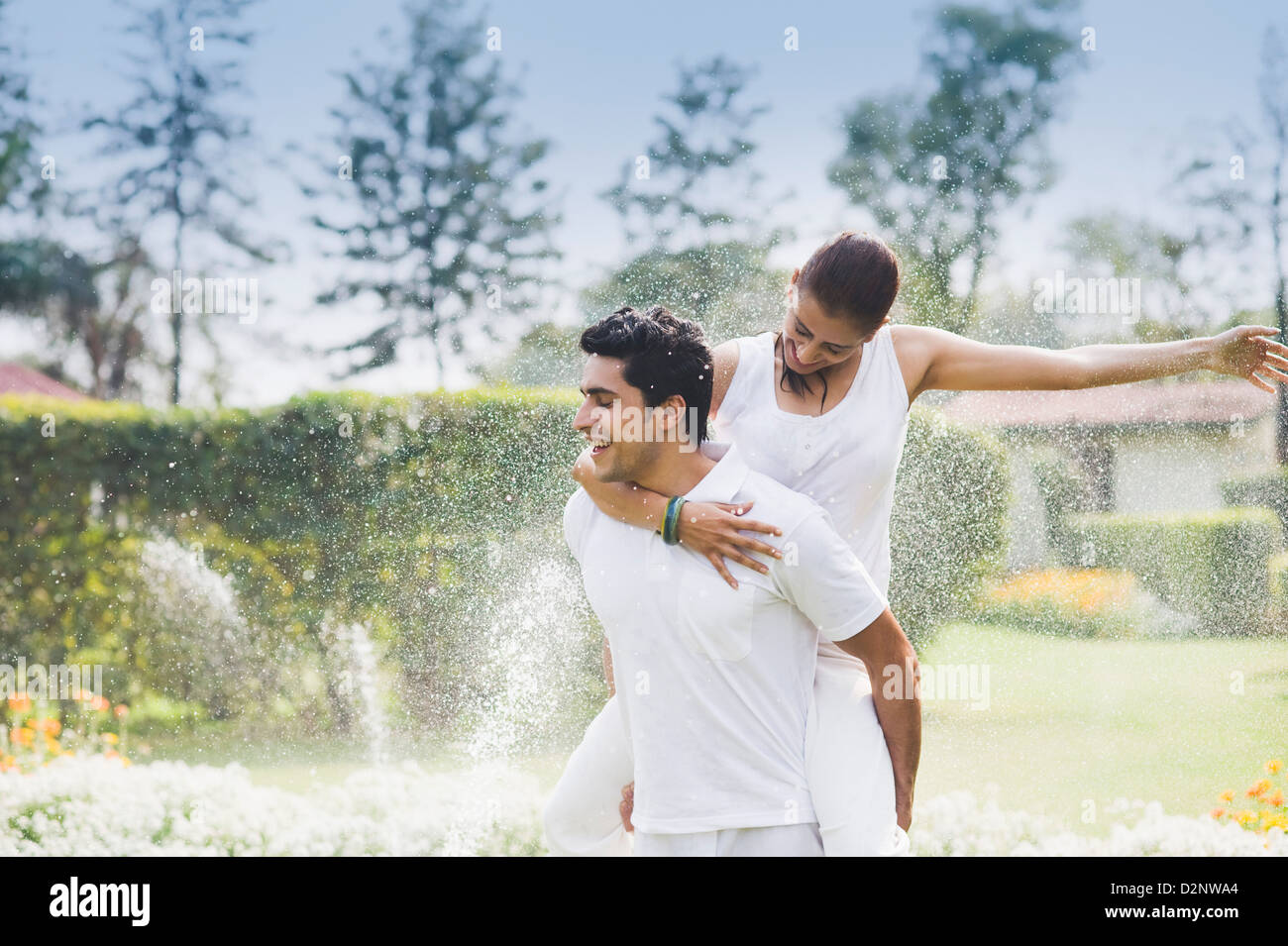 Woman riding piggyback on a man Stock Photo - Alamy