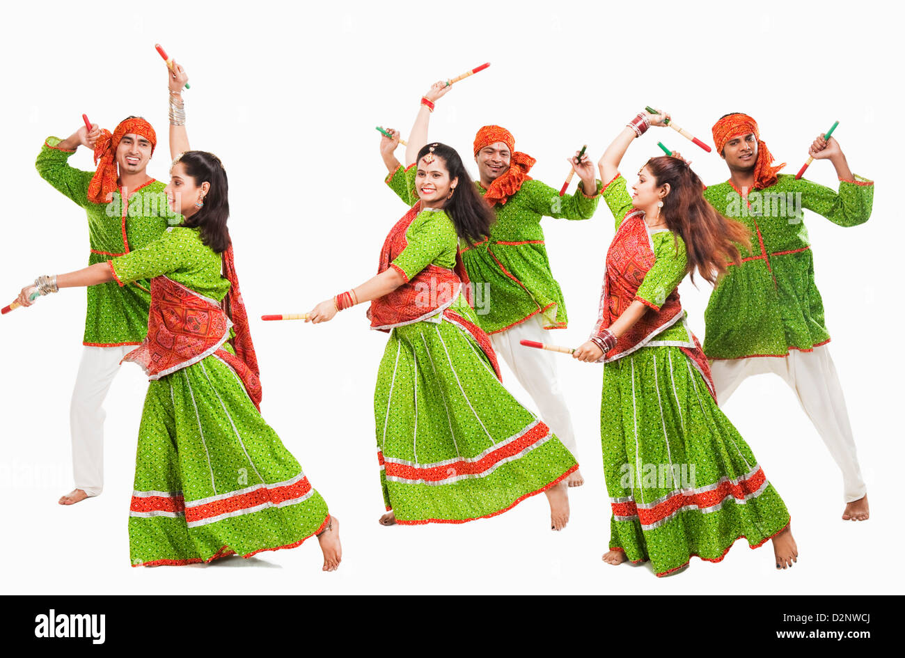 Couples performing dandiya Stock Photo - Alamy