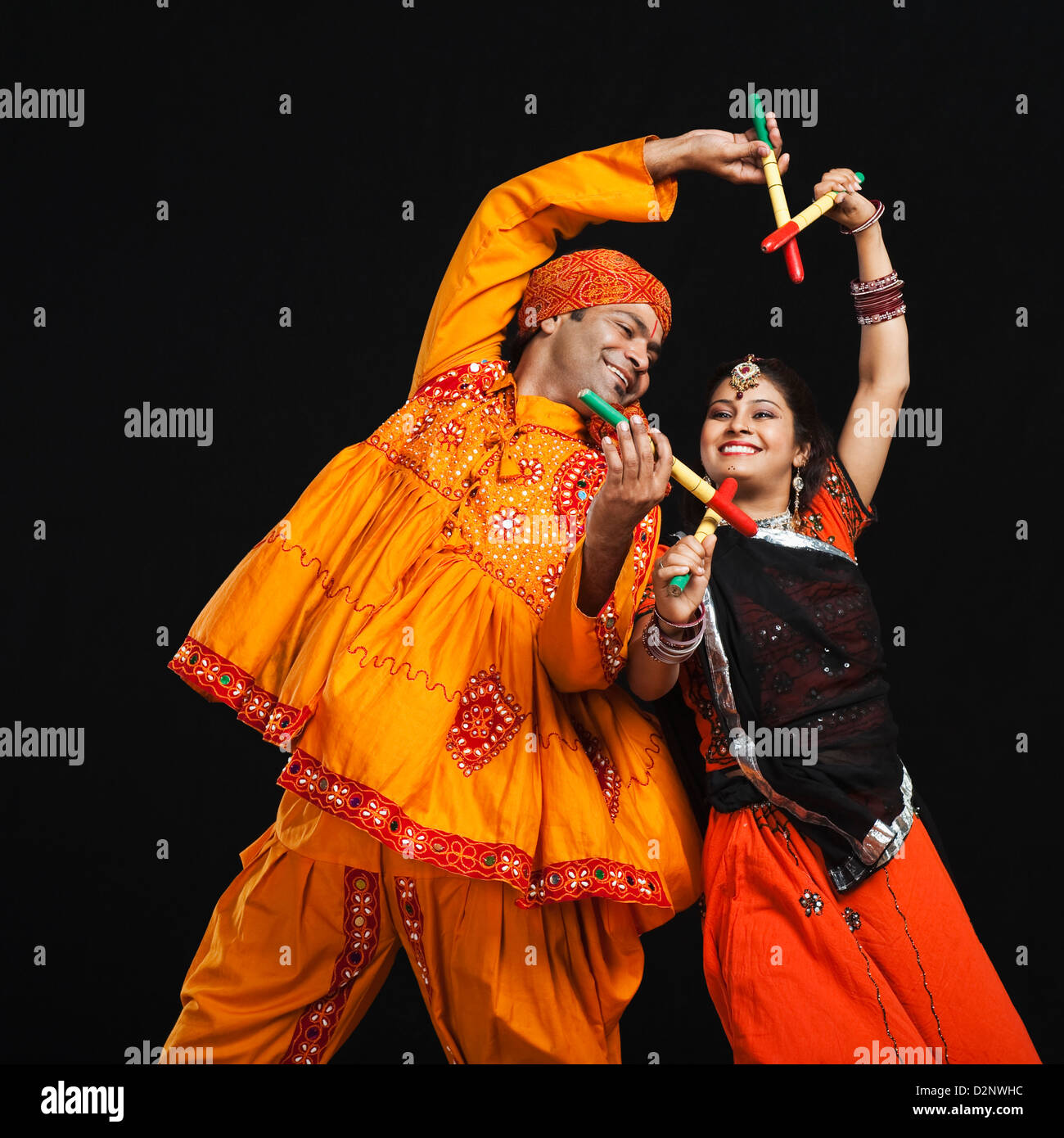 Couple performing dandiya hi-res stock photography and images - Alamy