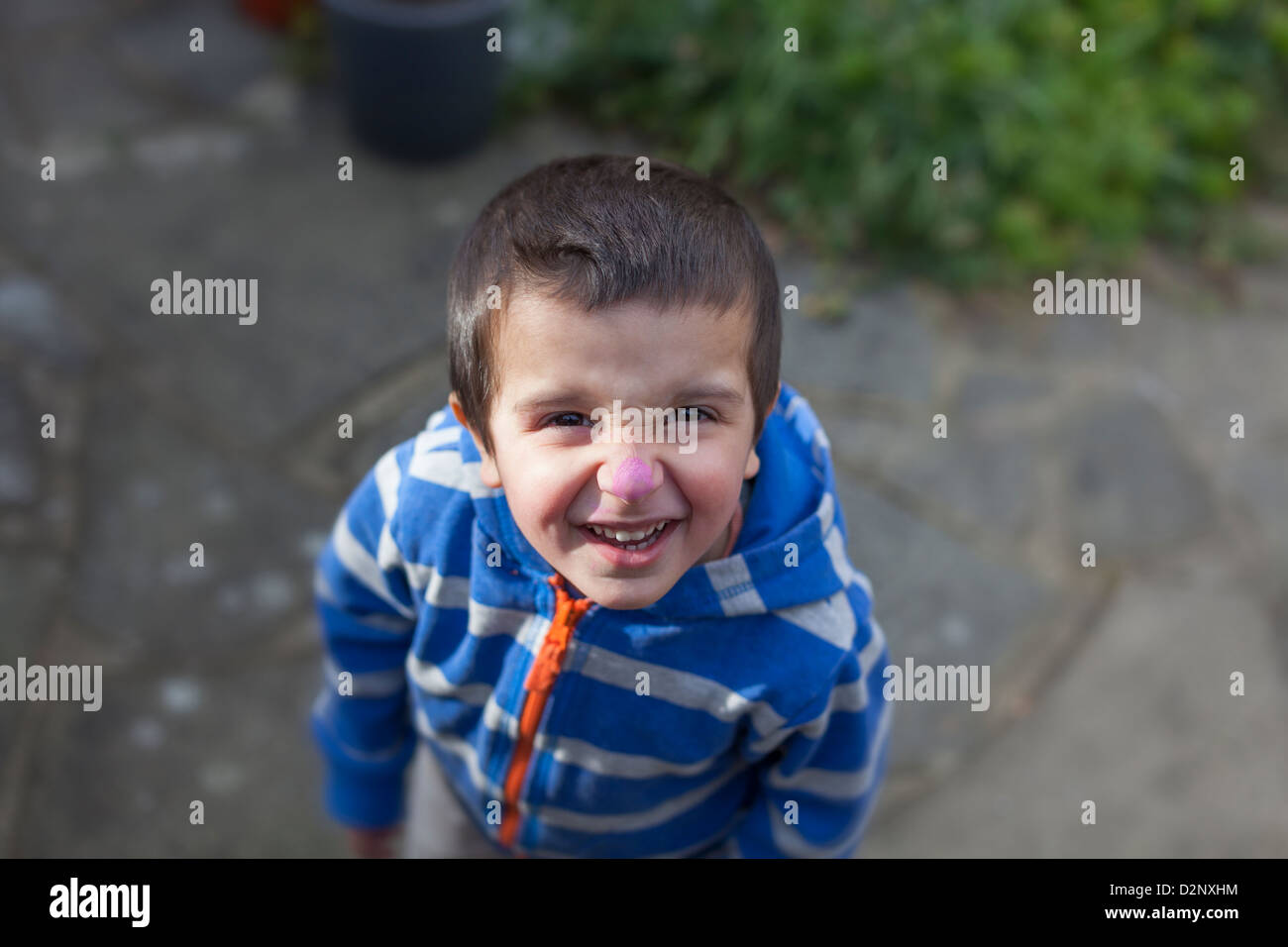 Boy smiling ,looking up-selective focus Stock Photo - Alamy