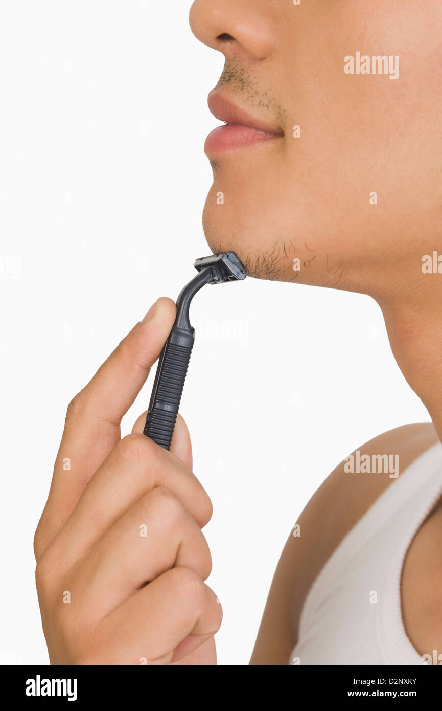 Man shaving his face Stock Photo - Alamy