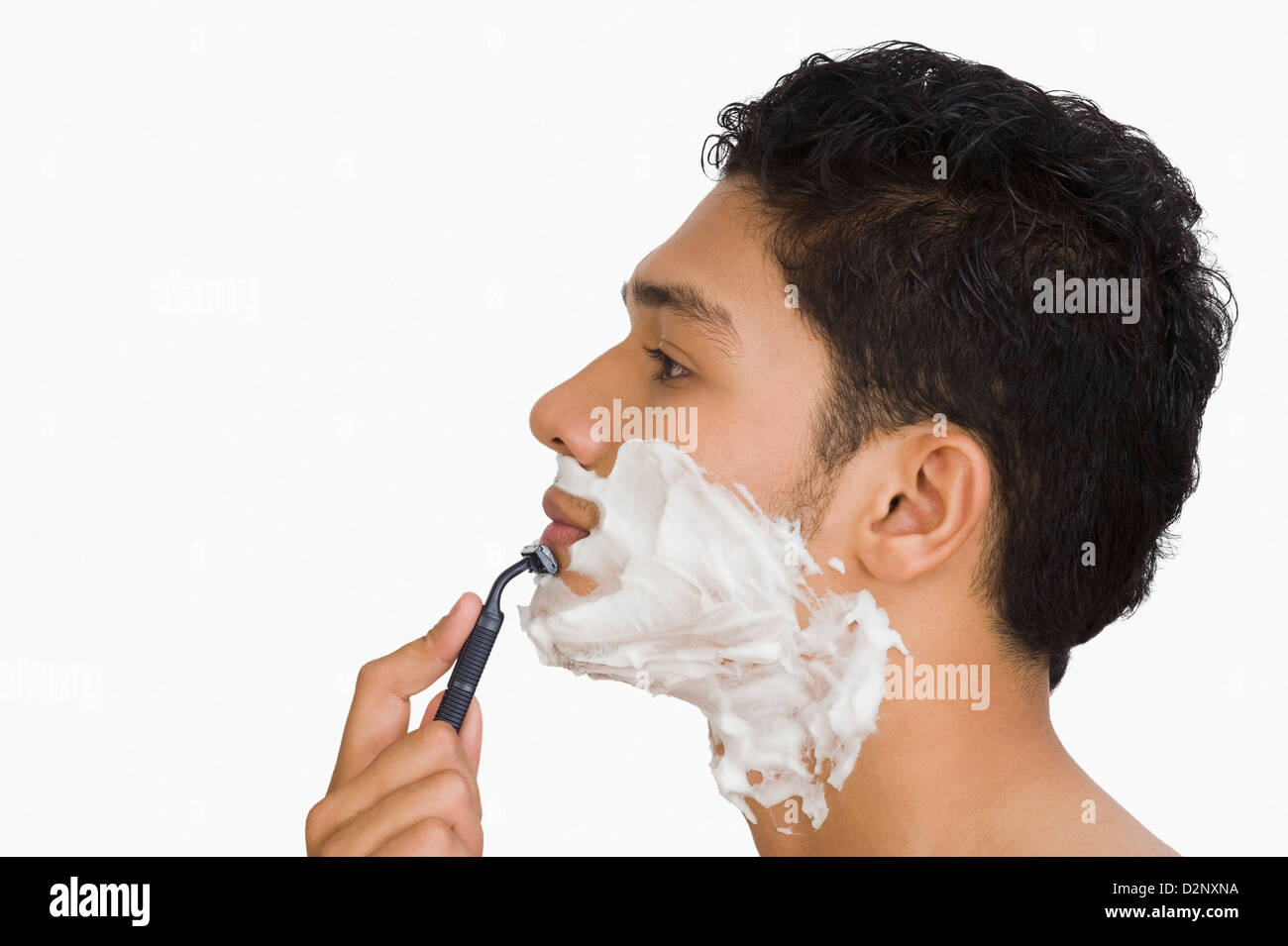 Man shaving his face Stock Photo - Alamy