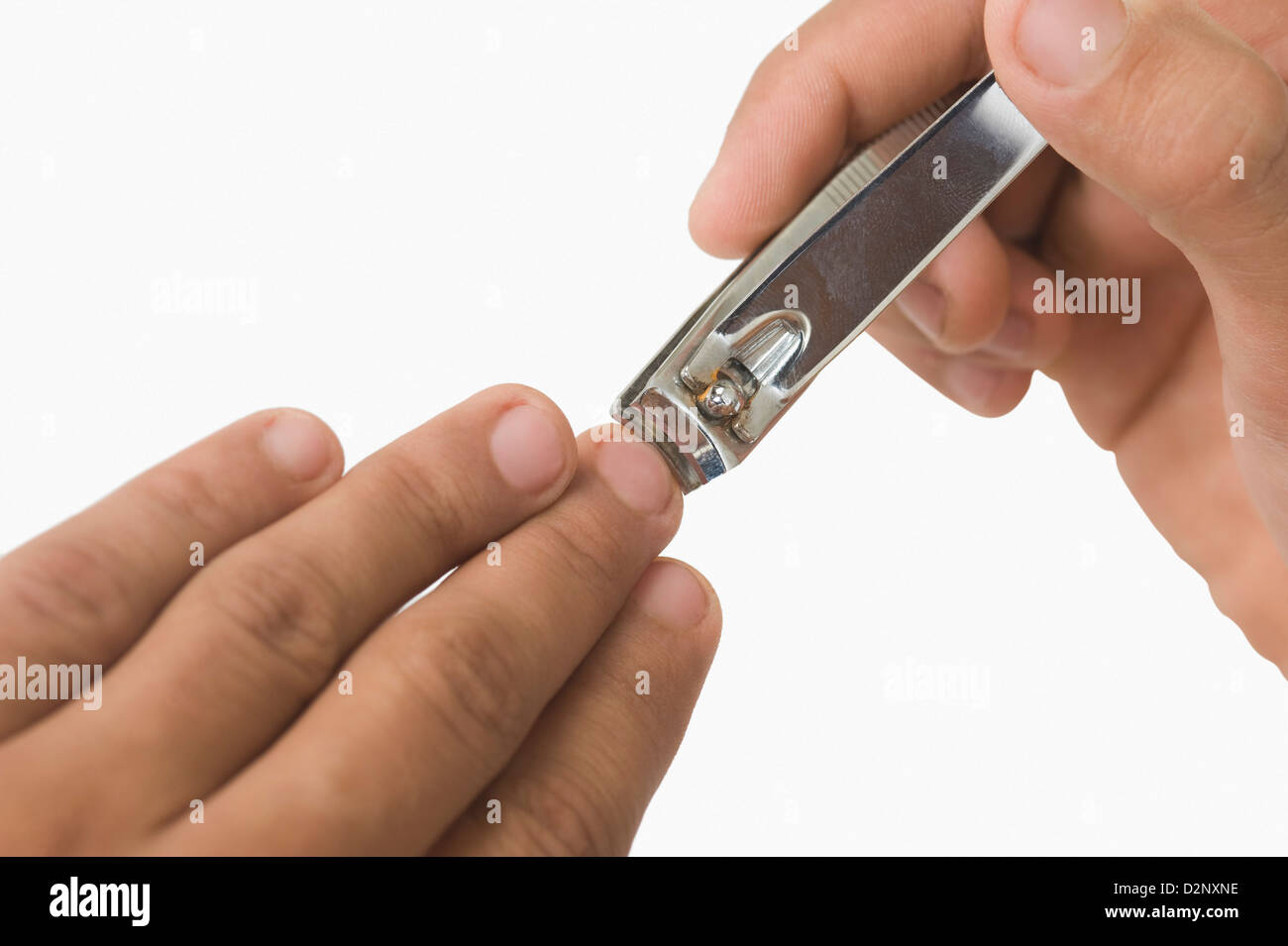 Man trimming fingernails with a nail clipper Stock Photo - Alamy