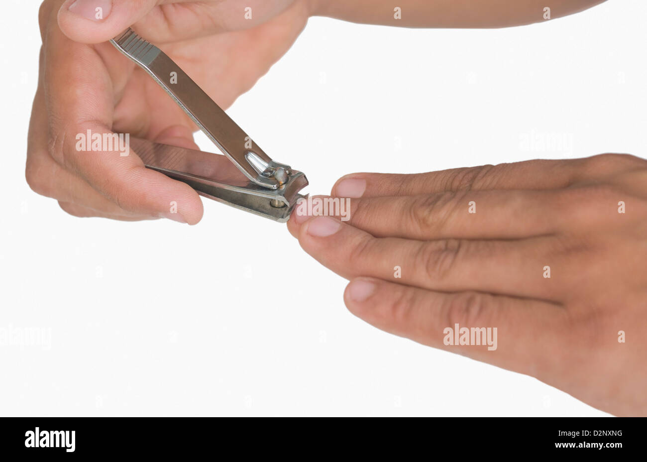 Man trimming fingernails with a nail clipper Stock Photo - Alamy