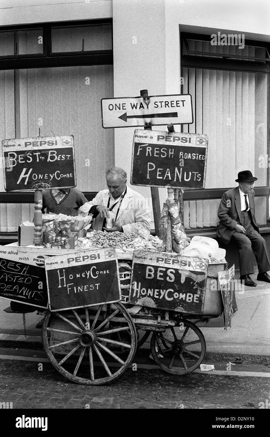 Street vendor selling Fresh Roasted Peanuts and Honey Combe ...