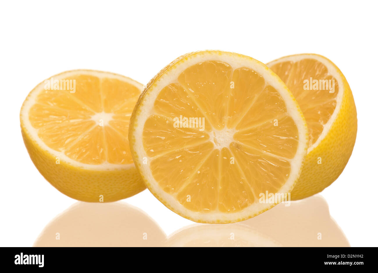 Half of lemon with slice isolated on white background Stock Photo - Alamy
