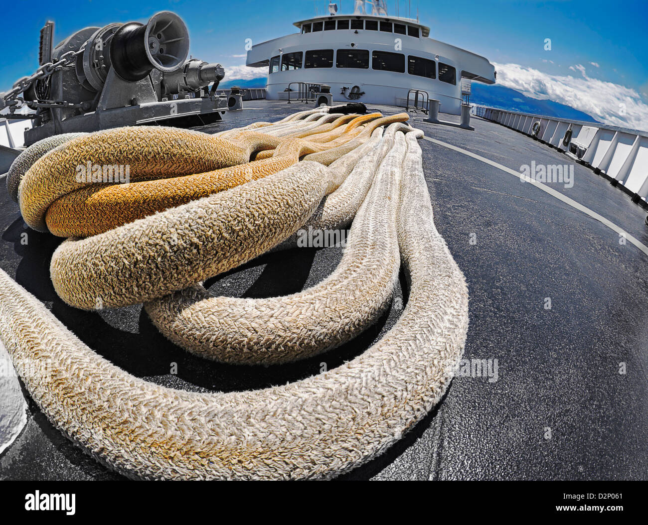 Large and thick cables on a deck of passenger ferry; daytime, sunny ...