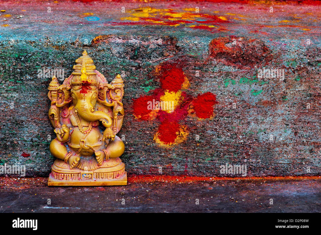 Hindu Elephant God. Lord Ganesha statue against coloured hindu temple ...