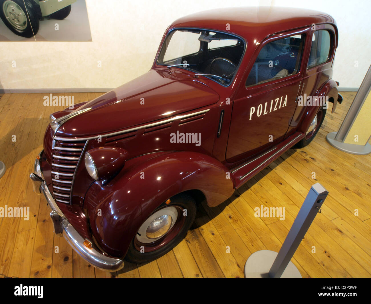 A red FIAT police car, used by the Italian polizia (police), is a ...