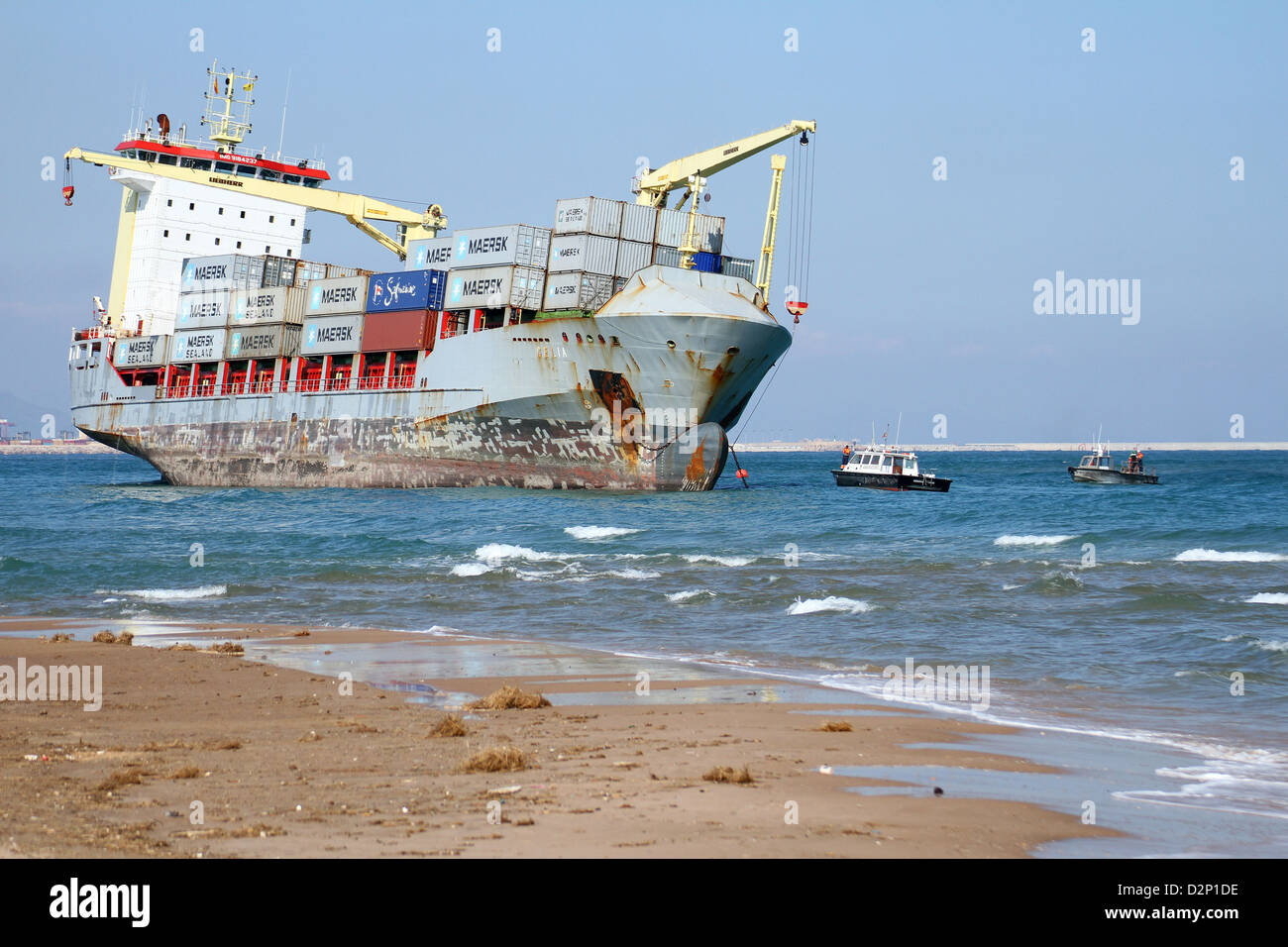 Container ship aground in a beach after storm Stock Photo - Alamy