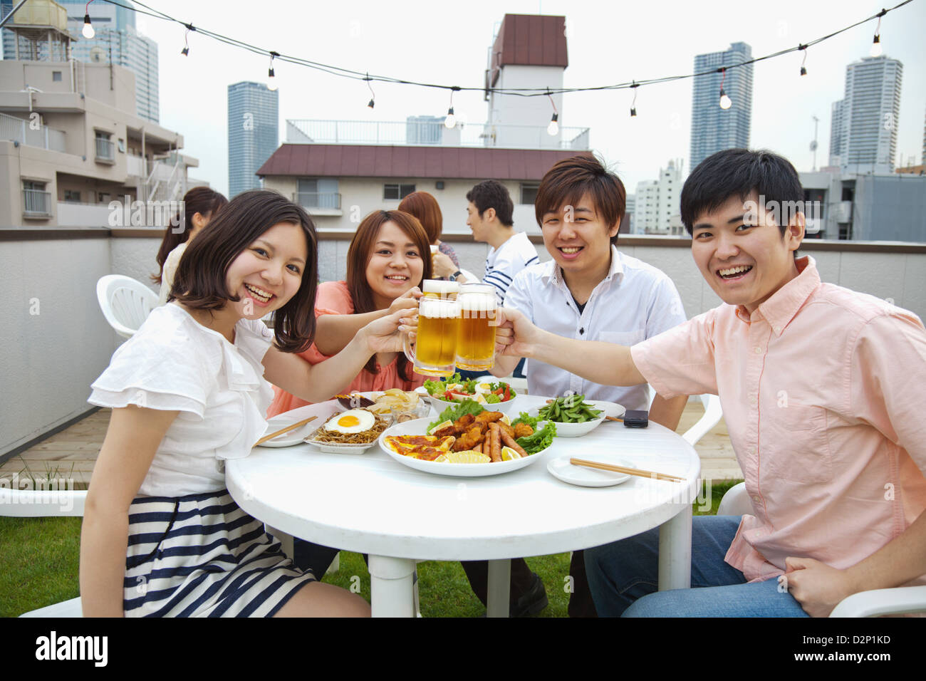 Friends drinking together Stock Photo - Alamy
