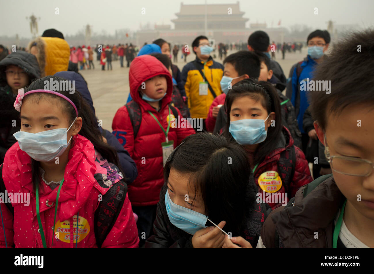 A group of children wear the masks on Tiananmen Square in thick haze in ...