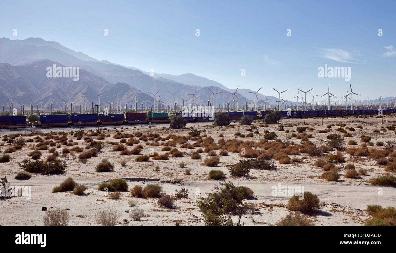 wind power turbines just outside palm springs with long freight train ...