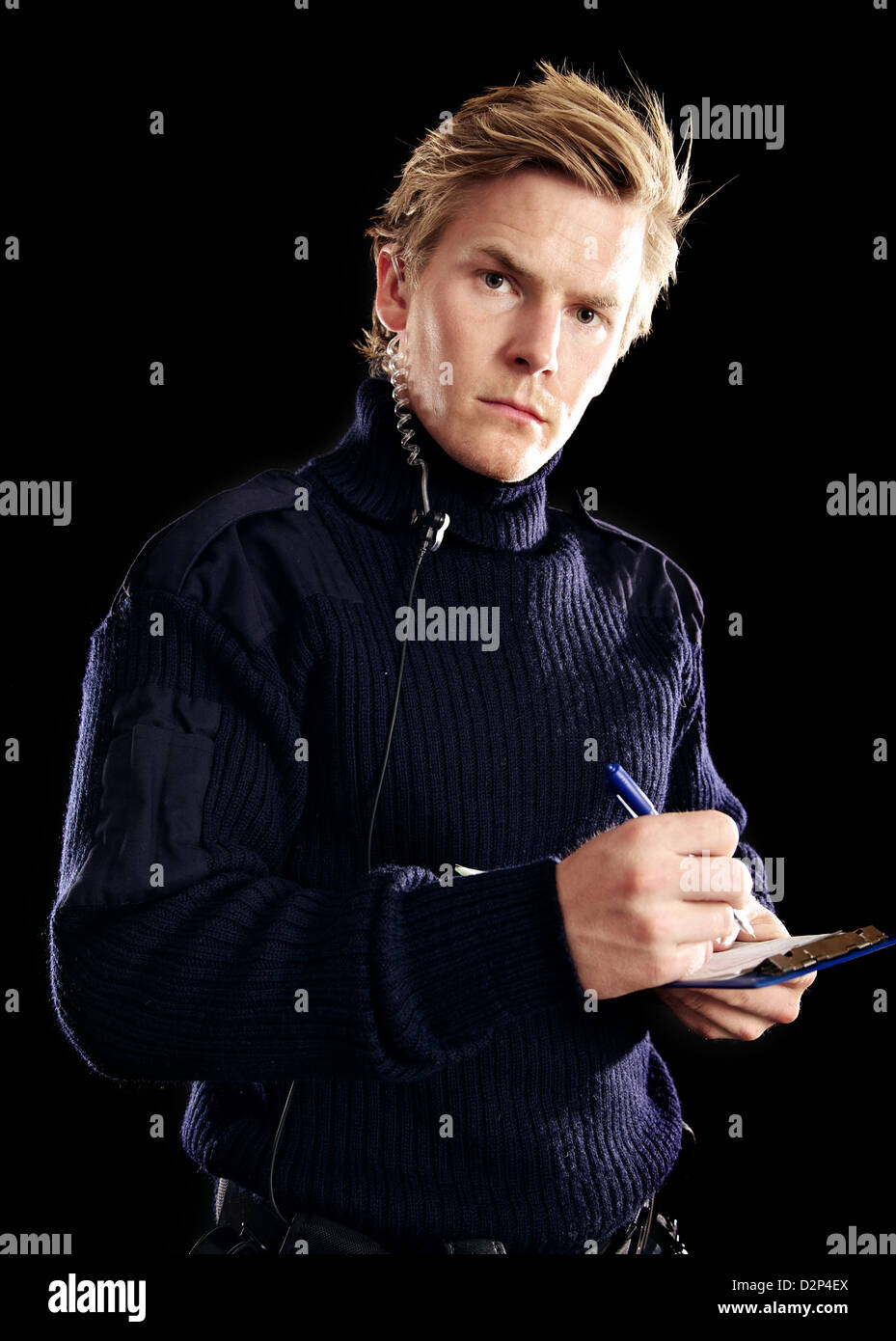 Handsome police on duty with a pen writing something on his notes Stock ...