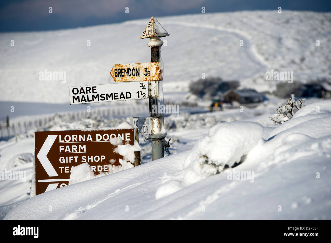 A road sign buried in a snowdrift on the A39 Somerset between Porlock ...