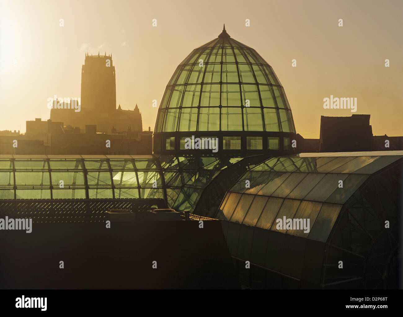 Vaulted glass roof of a modern shopping centre with Liverpool Cathedral ...