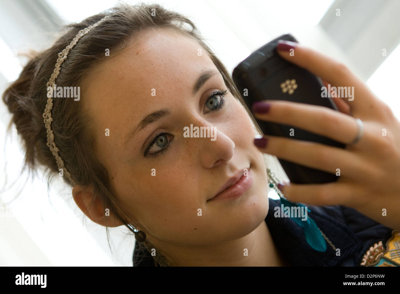 A girl using a mobile phone Stock Photo - Alamy