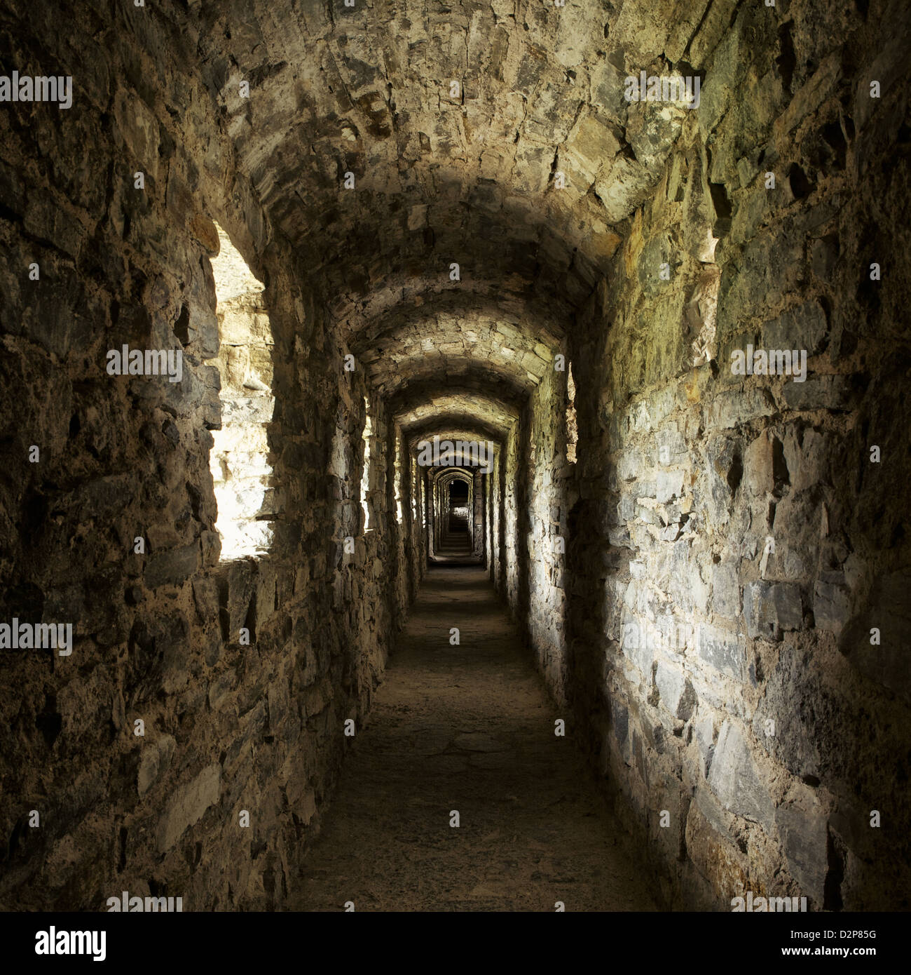 long stone corridor with windows in ancient castle Stock Photo - Alamy