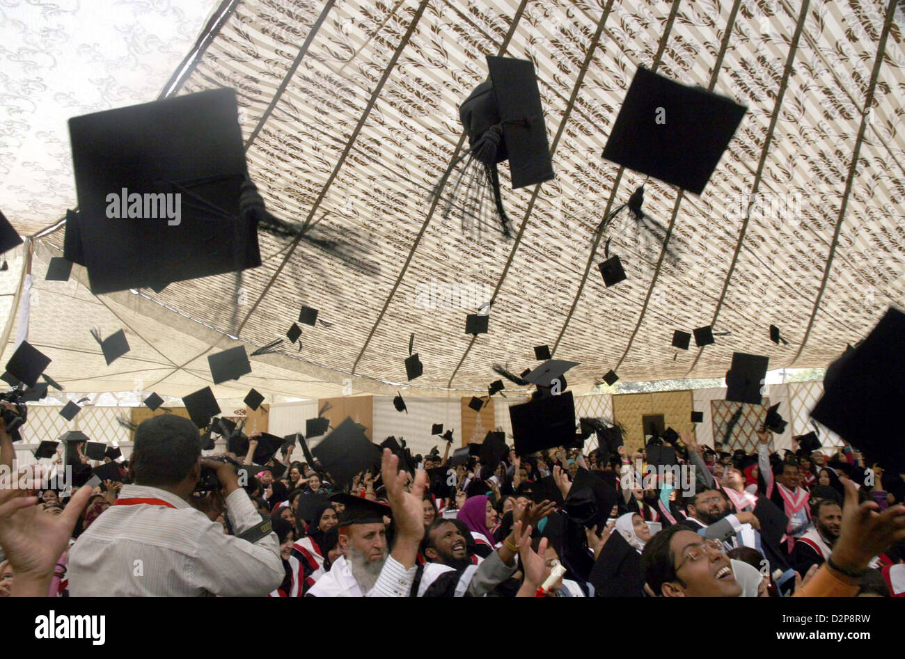 Students of Karachi University throwing their hats in air to celebrate ...