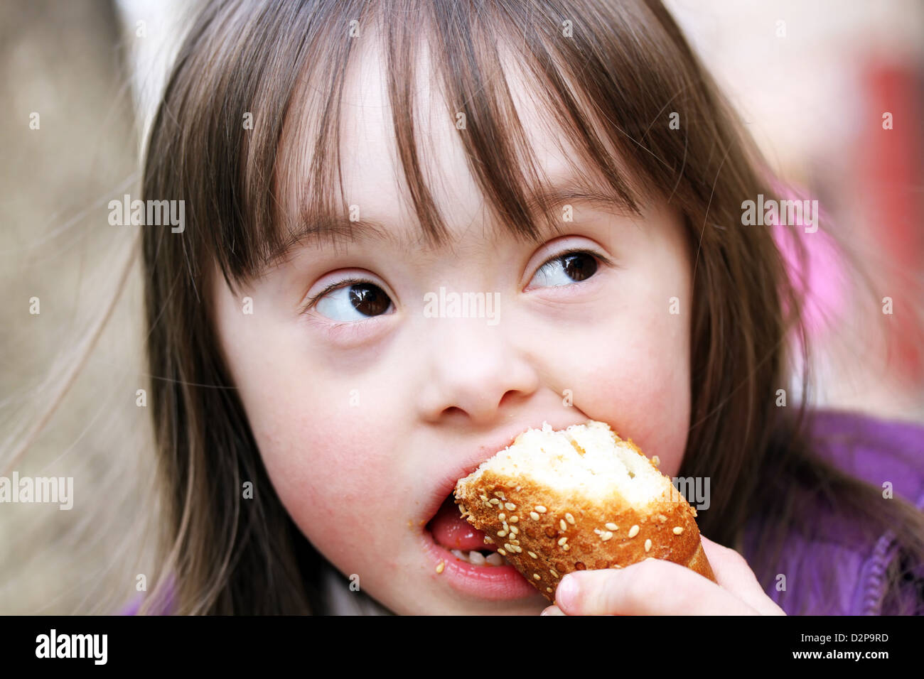 Portrait of beautiful girl eating baguette Stock Photo - Alamy
