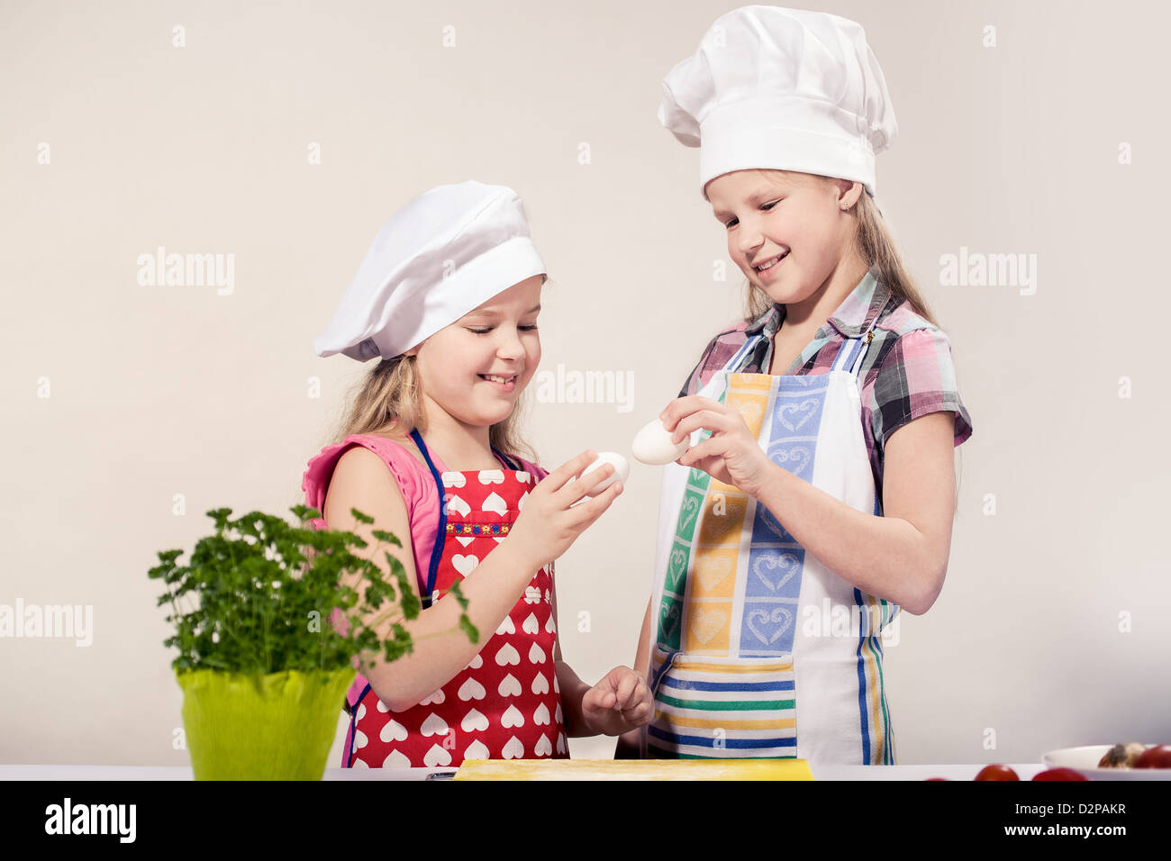 young girls baking cakes in the kitchen Stock Photo - Alamy