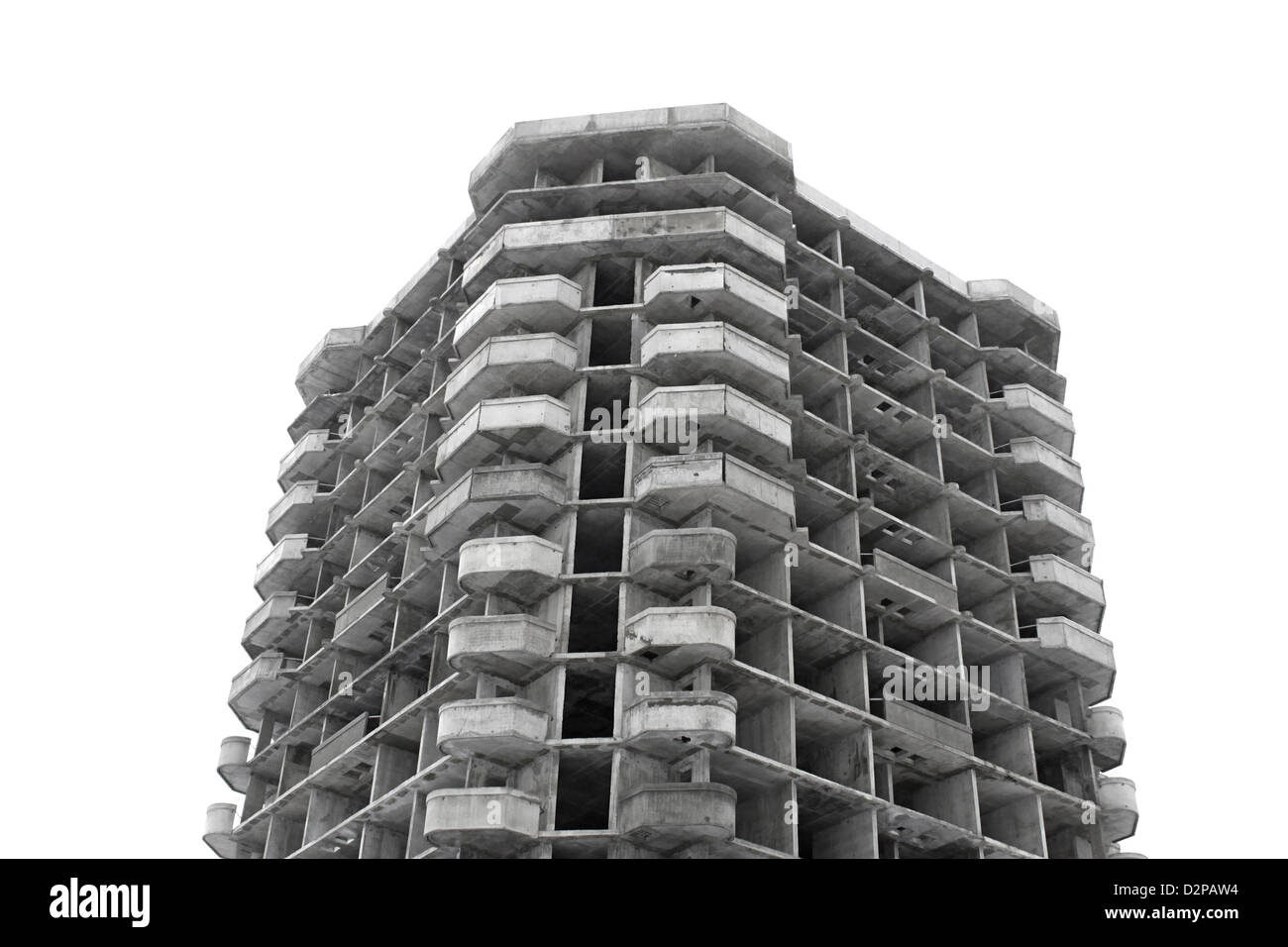 Unfinished high rise building concrete structure on white background ...
