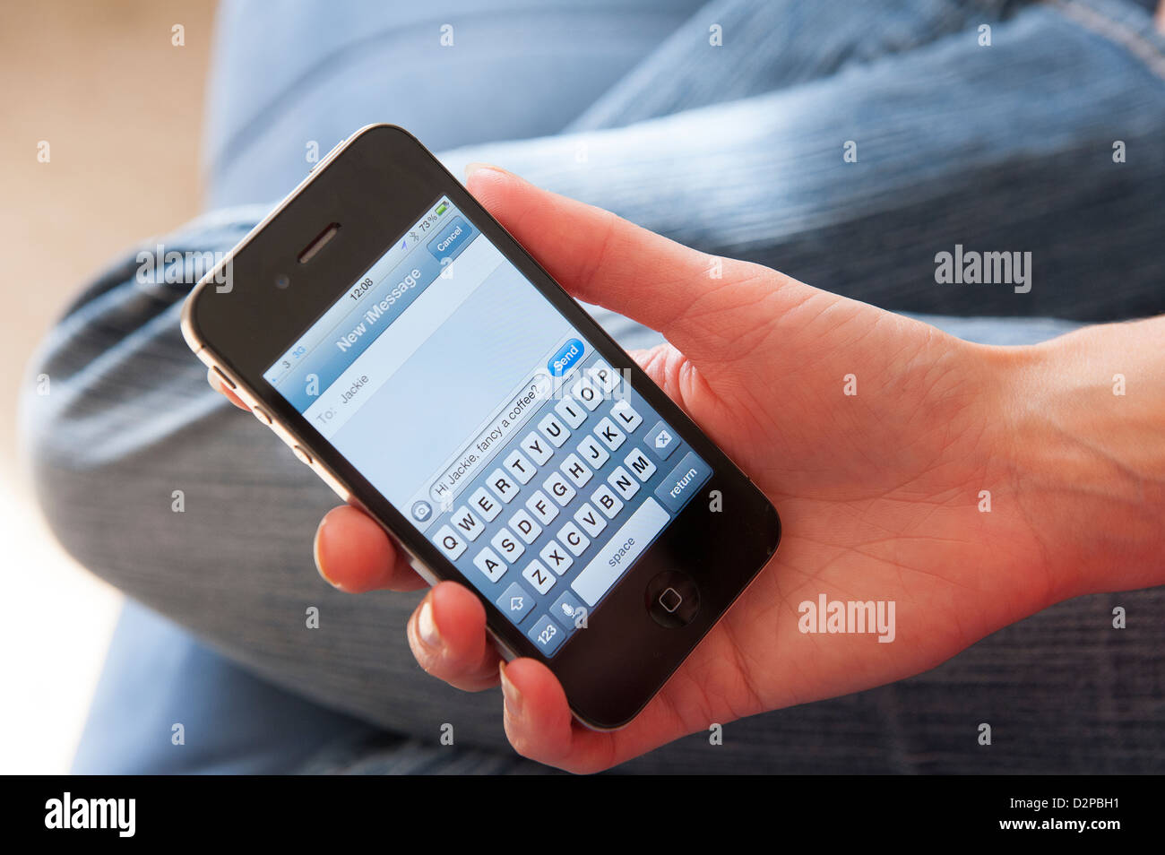 Person sending a text message using an apple iphone Stock Photo - Alamy