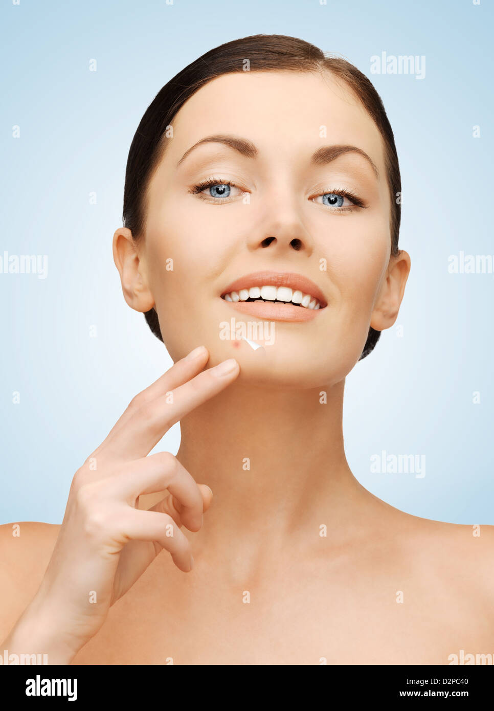 beautiful woman pointing to chin Stock Photo - Alamy