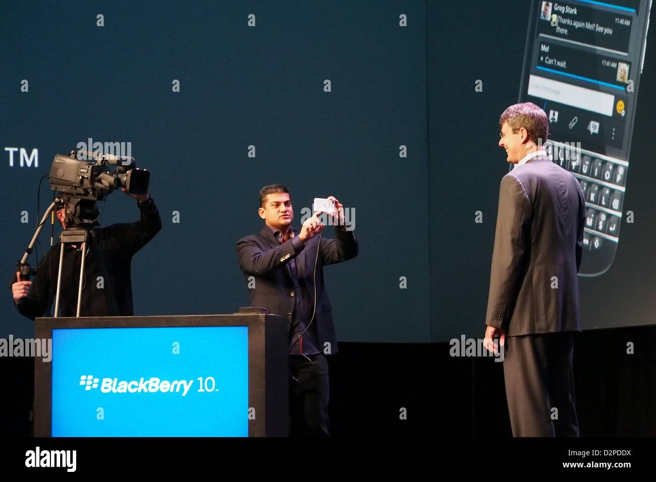 CEO of Research in Motion (RIM, R), Thorsten Heins, presents the new ...